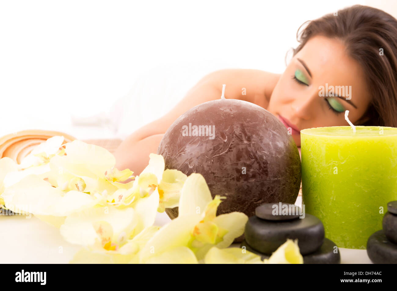 A young beautiful woman relaxing at a spa (wellness concept Stock Photo ...