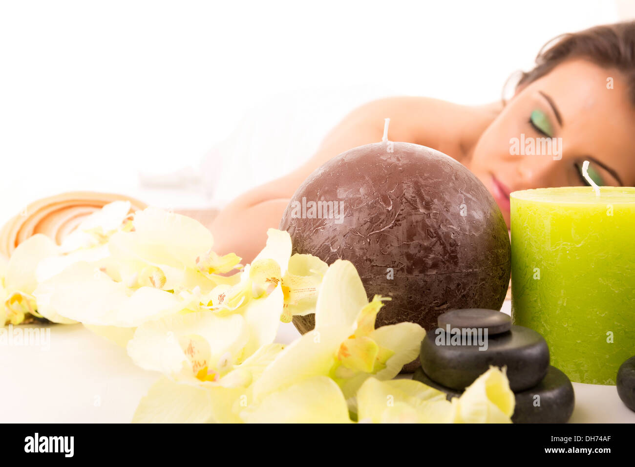A young beautiful woman relaxing at a spa (wellness concept Stock Photo ...