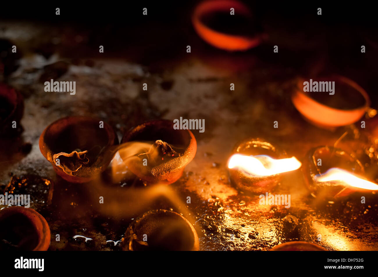 Burning oil lamps at religious temple. India Stock Photo - Alamy