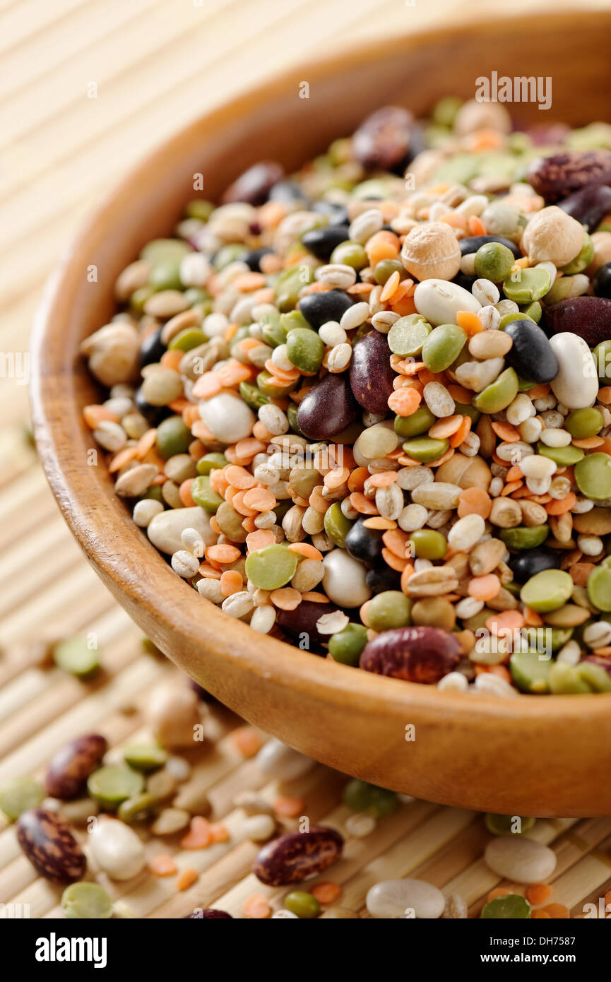 Wooden bowl full of dried legumes and cereals (minestrone mix Stock ...