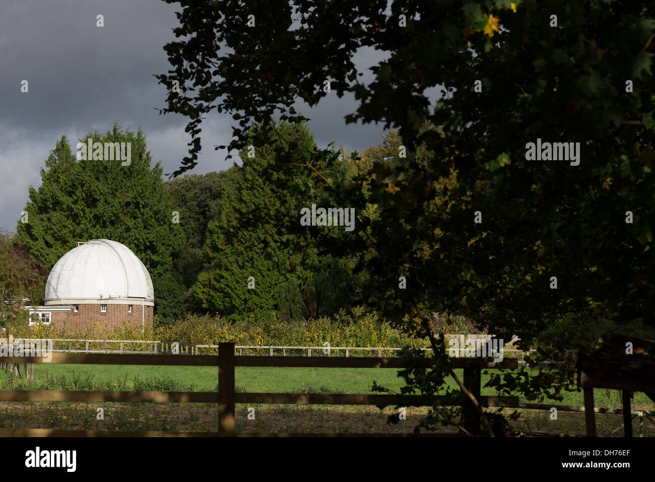 Observatory in a field lined with trees at Cambridge university ...