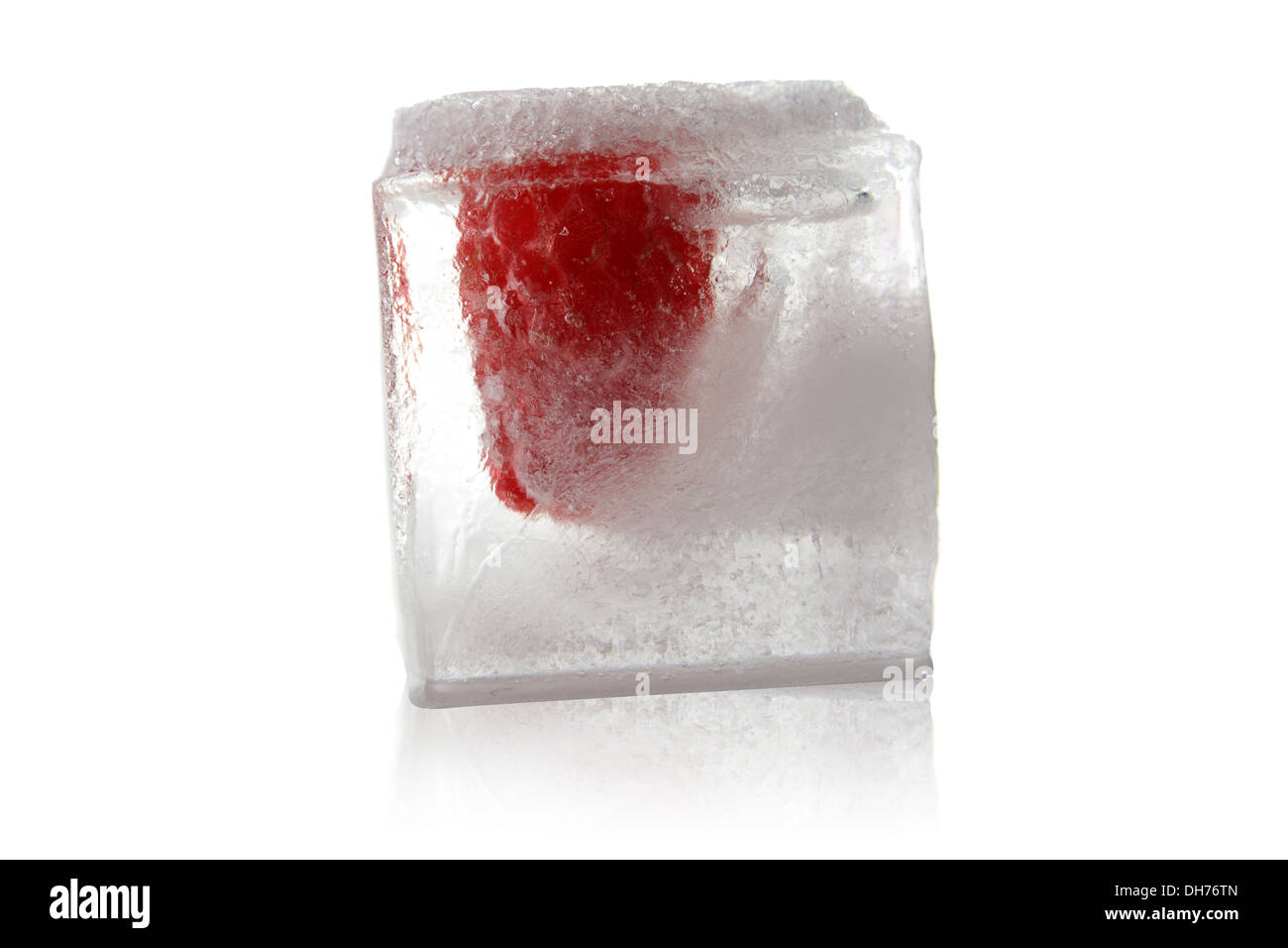Raspberry frozen in ice cube Stock Photo - Alamy