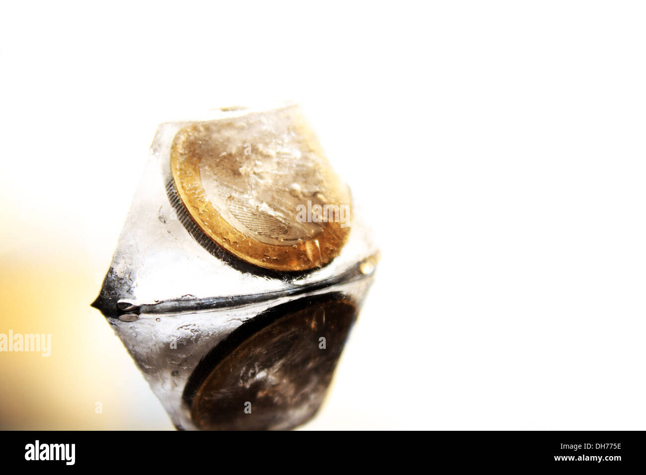 Ice Cube with Euro Coin Stock Photo - Alamy