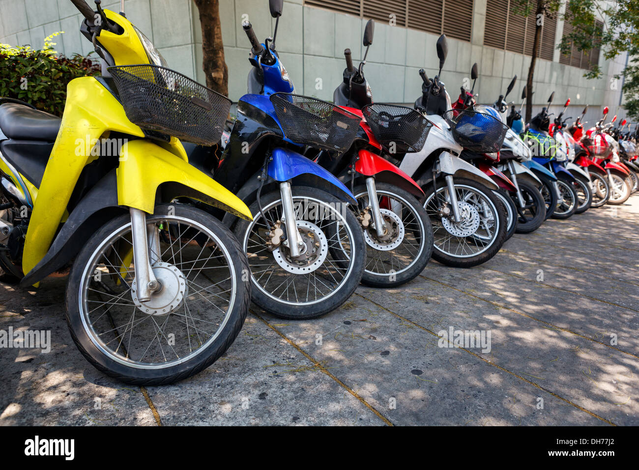 Many motorbikes at the parking near big store Stock Photo - Alamy