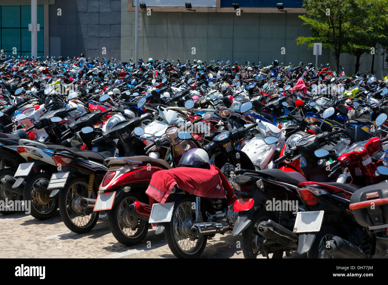 Many motorbikes at the parking near big store Stock Photo - Alamy