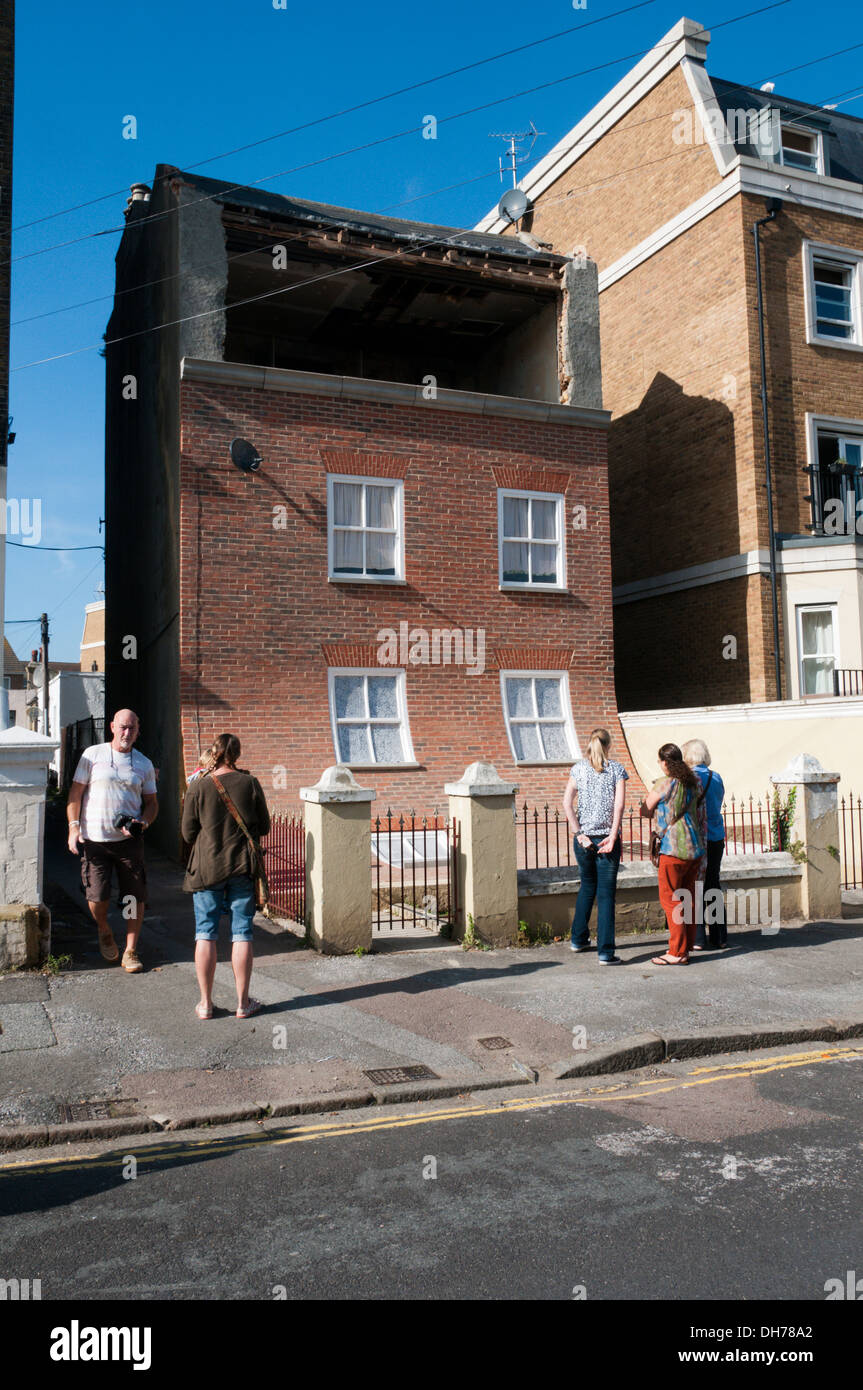 'From the knees of my nose to the belly of my toes', the house sliding ...