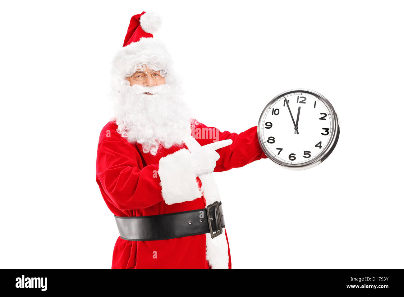 Smiling Santa Claus pointing on a clock Stock Photo - Alamy