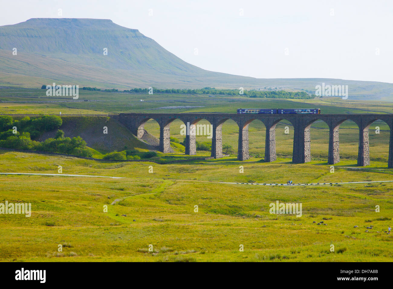Passenger train on Ribblehead Viaduct below Ingleborough mountain Stock ...
