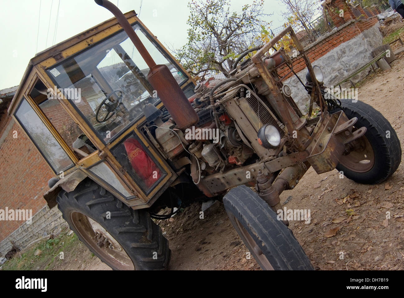 An old tractor working Tractor parked by the side of the road in a ...