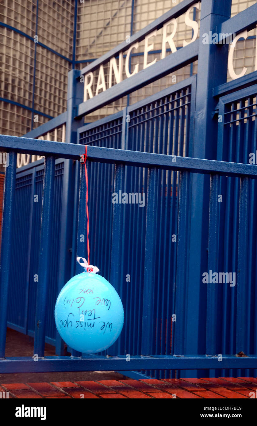 Exterior - A balloon with a farewell message tied to gates Rangers ...
