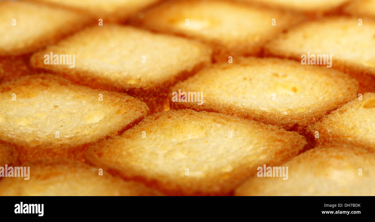 Many small dried rusks bread loaf toast biscuits as texture background ...