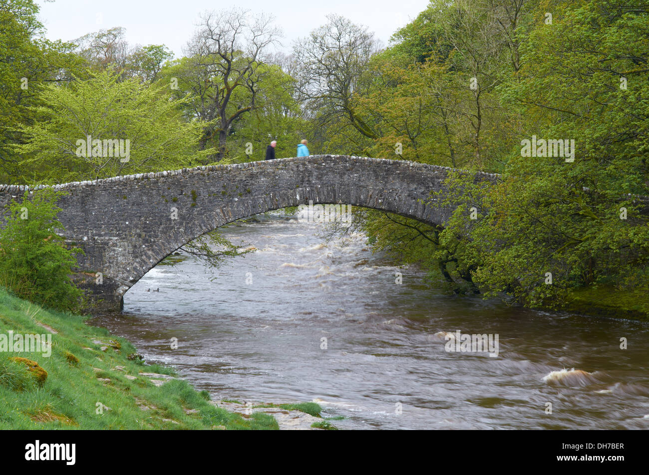 Walkers on a bridge at Stainforth Force - Yorkshire Dales, England, UK ...