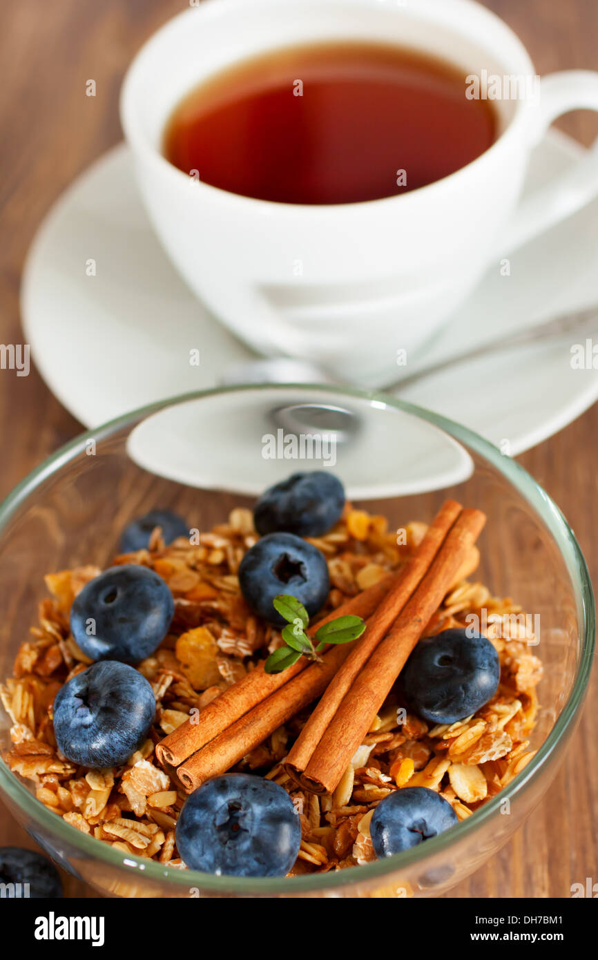 Granola with blueberry, cup of tea Stock Photo - Alamy