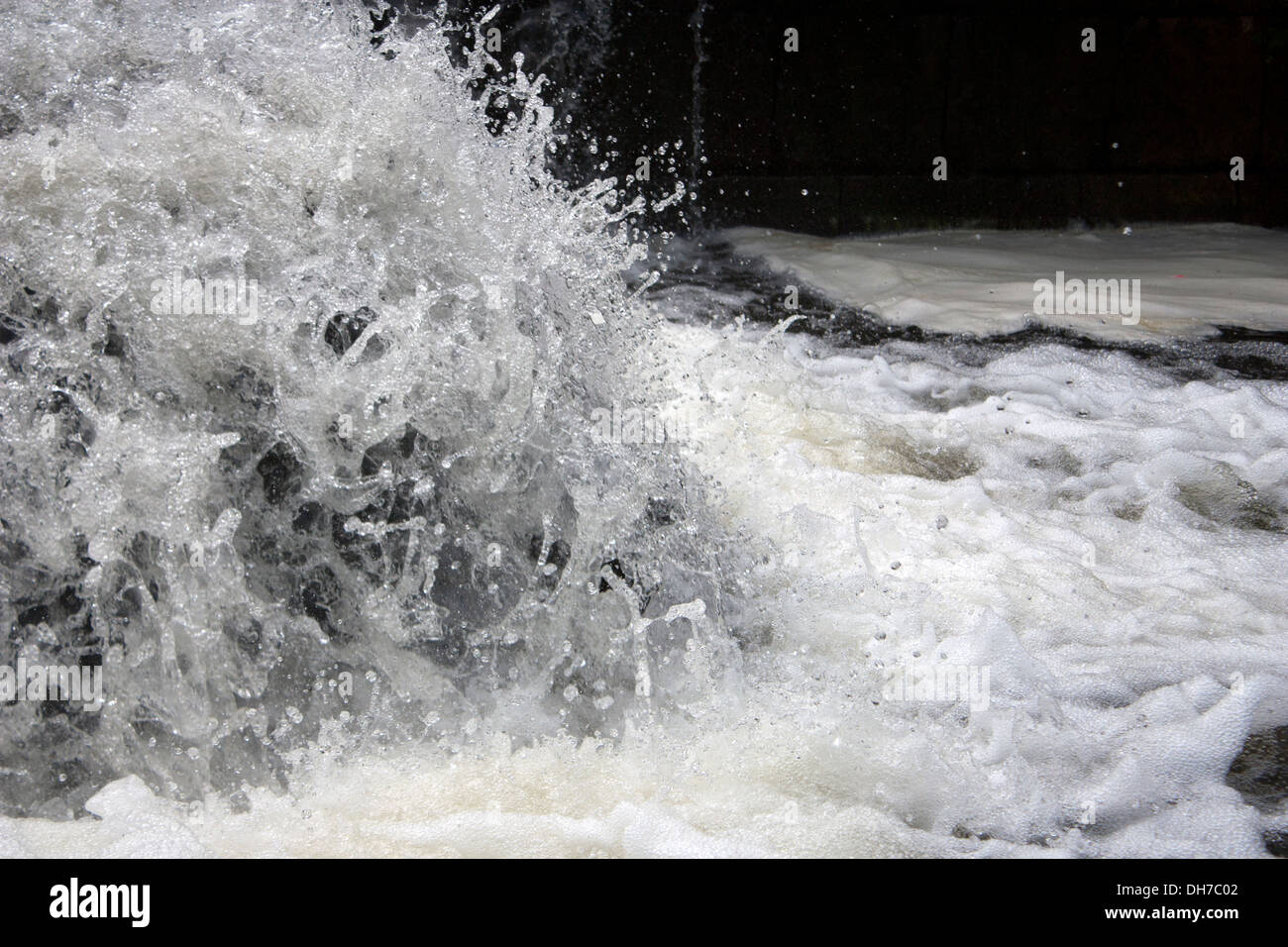 Water falling down a small waterfall Stock Photo - Alamy