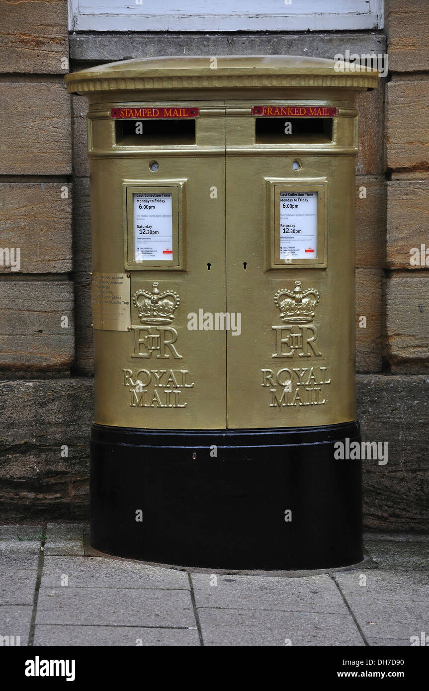 A gold letterbox commemorating the success of the London Olympics ...