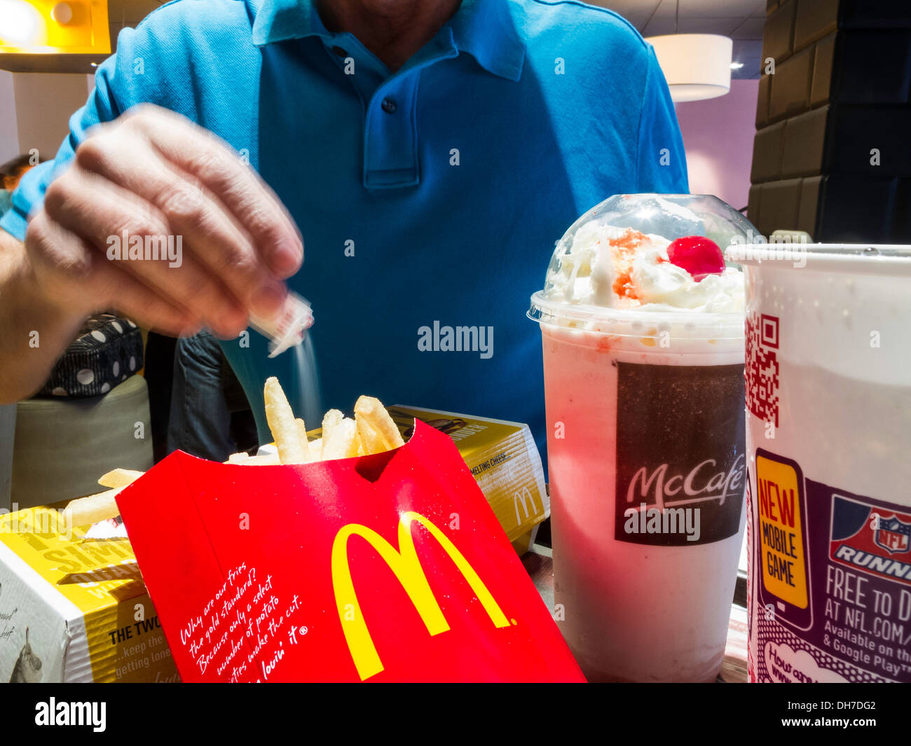 Man Eating at McDonald's Restaurant , Cheesebuger, French Fries and ...