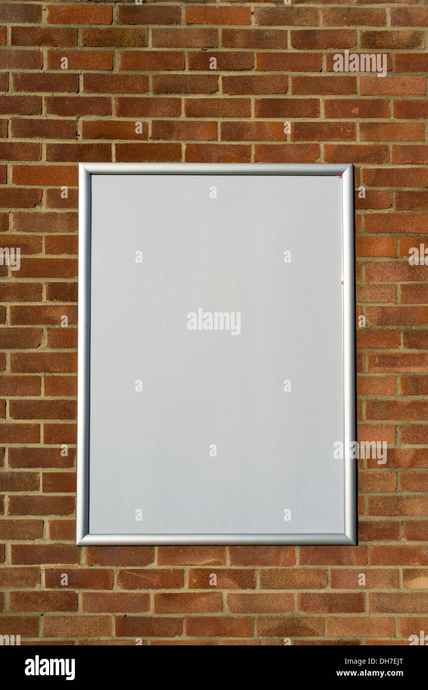 Empty, blank notice sign board on brick wall Stock Photo - Alamy