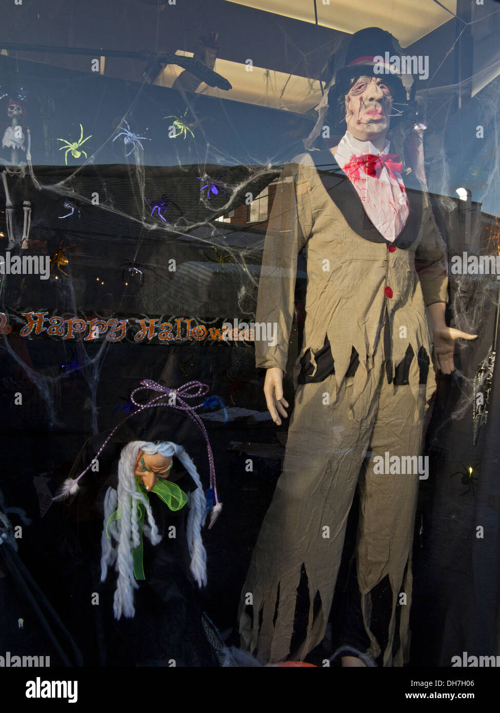 Halloween and Day of the Dead costumes display at the window of a shop ...