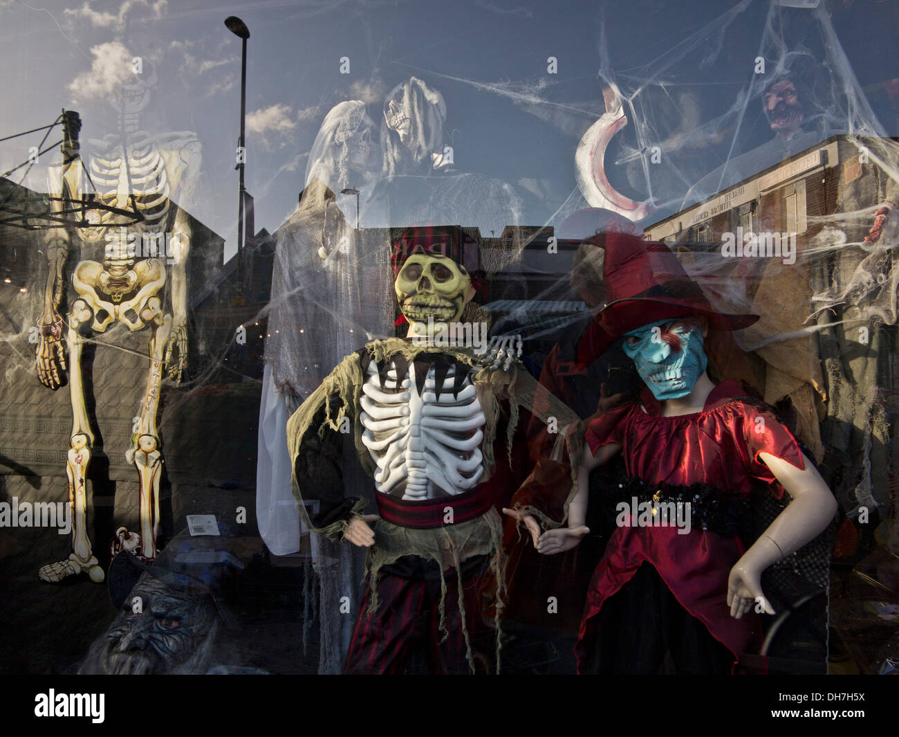 Halloween and Day of the Dead costumes display at the window of a shop ...