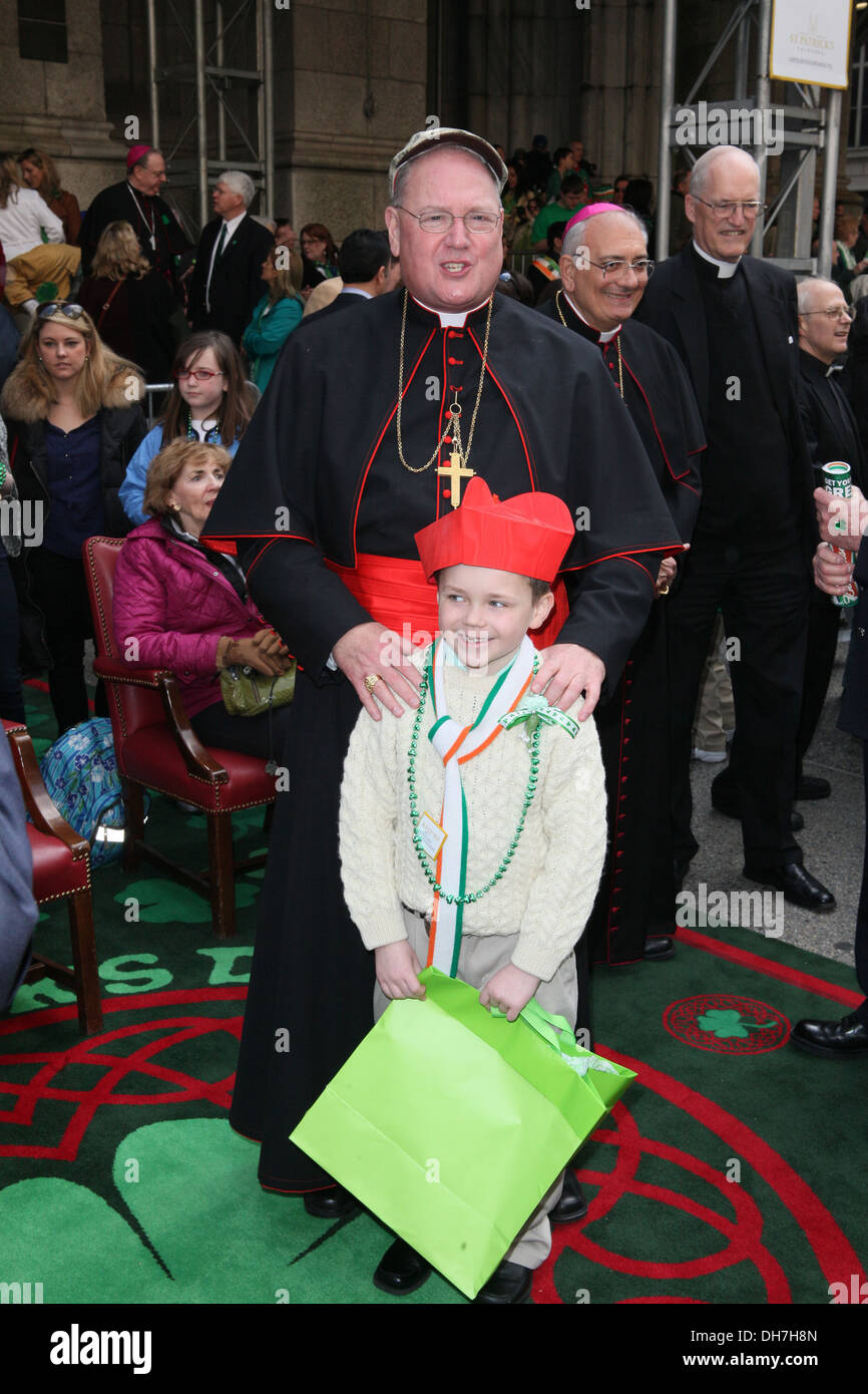 Cardinal Timothy Michael Dolan and a young follower trade hats 251st ...