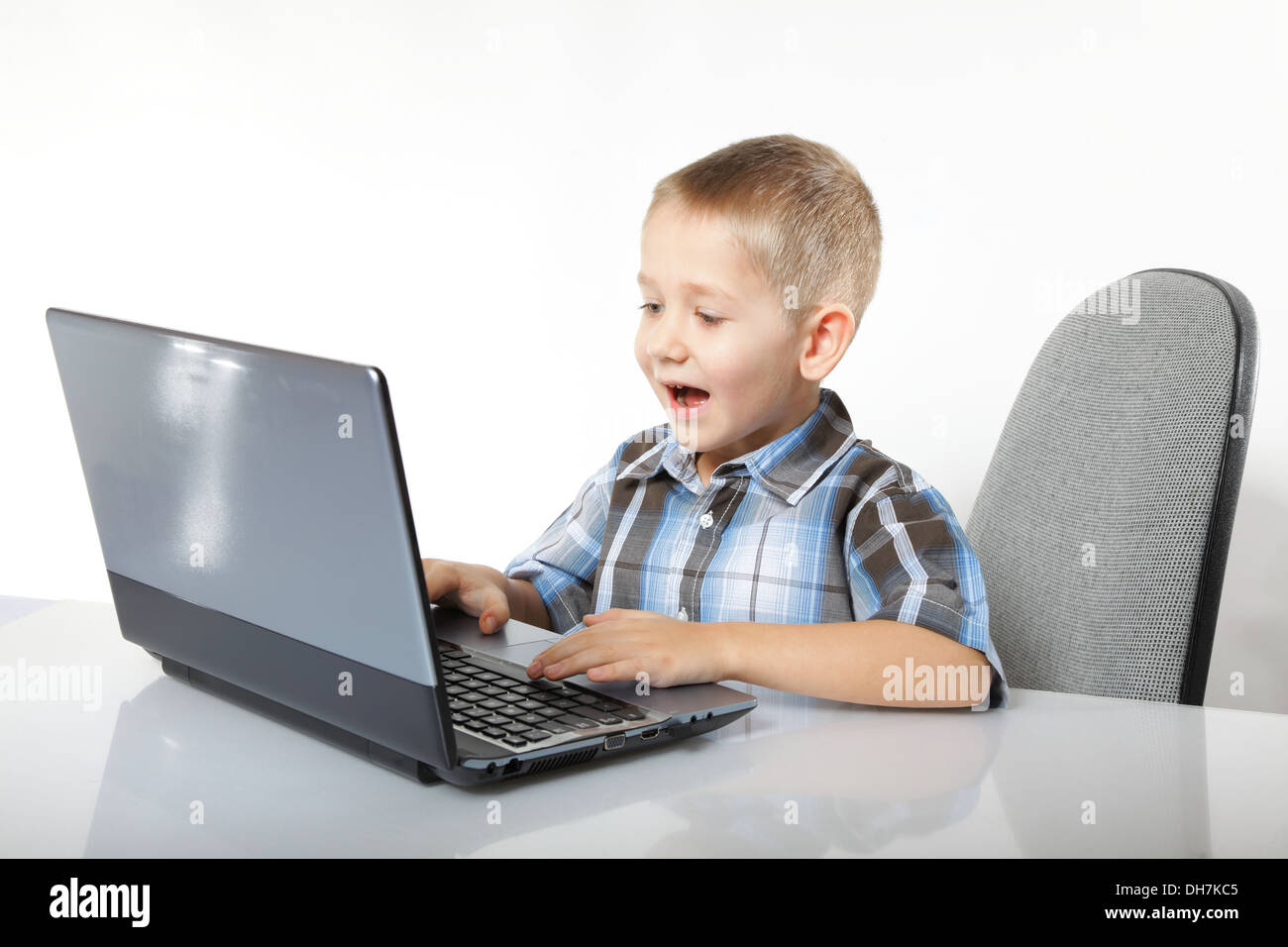 Computer addiction child boy with laptop notebook white background ...