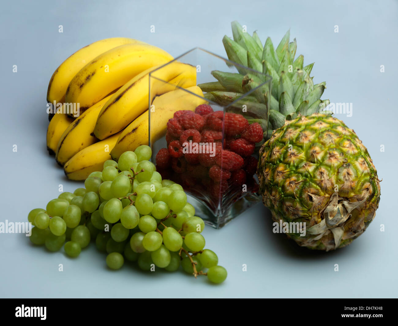 Fruit display, bananas, pineapple, grapes, raspberries Stock Photo - Alamy