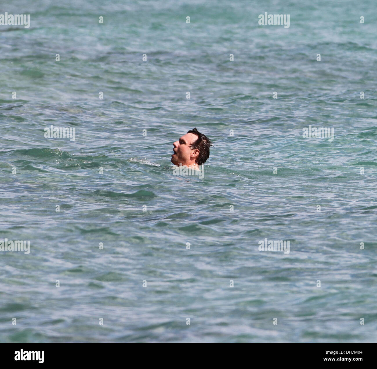 Christian Slater takes an impromptu dip in sea while taking a walk ...