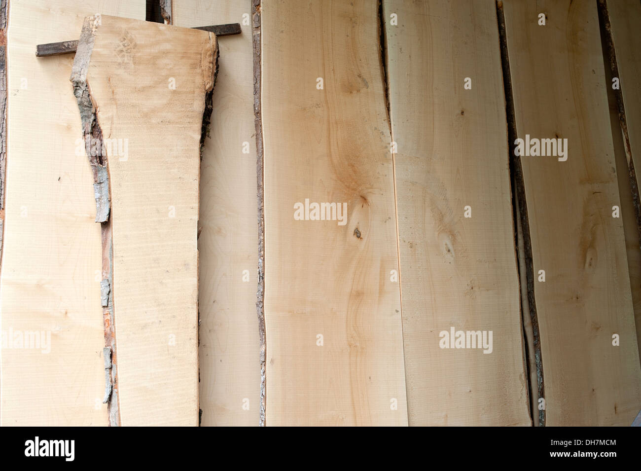 Tree trunks Newly Cut Rough Sawn Planks of Wood Stock Photo - Alamy