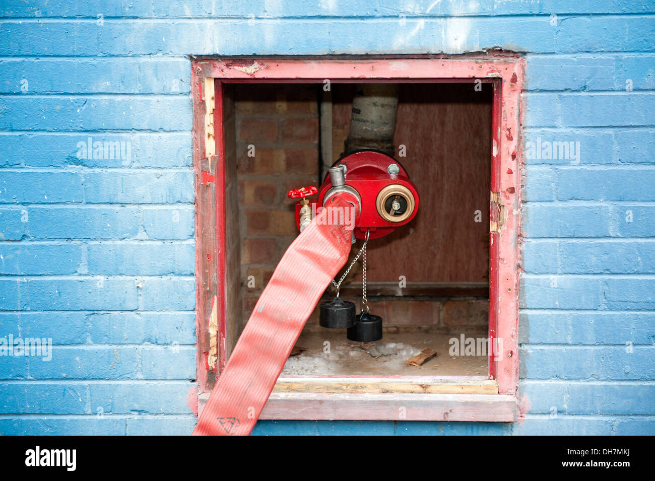 Fire hose feeding dry riser inlet valve Stock Photo - Alamy