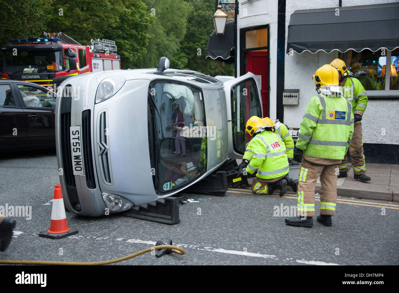 Car Crash on side overturned Fire & Rescue RTA RTC Stock Photo - Alamy