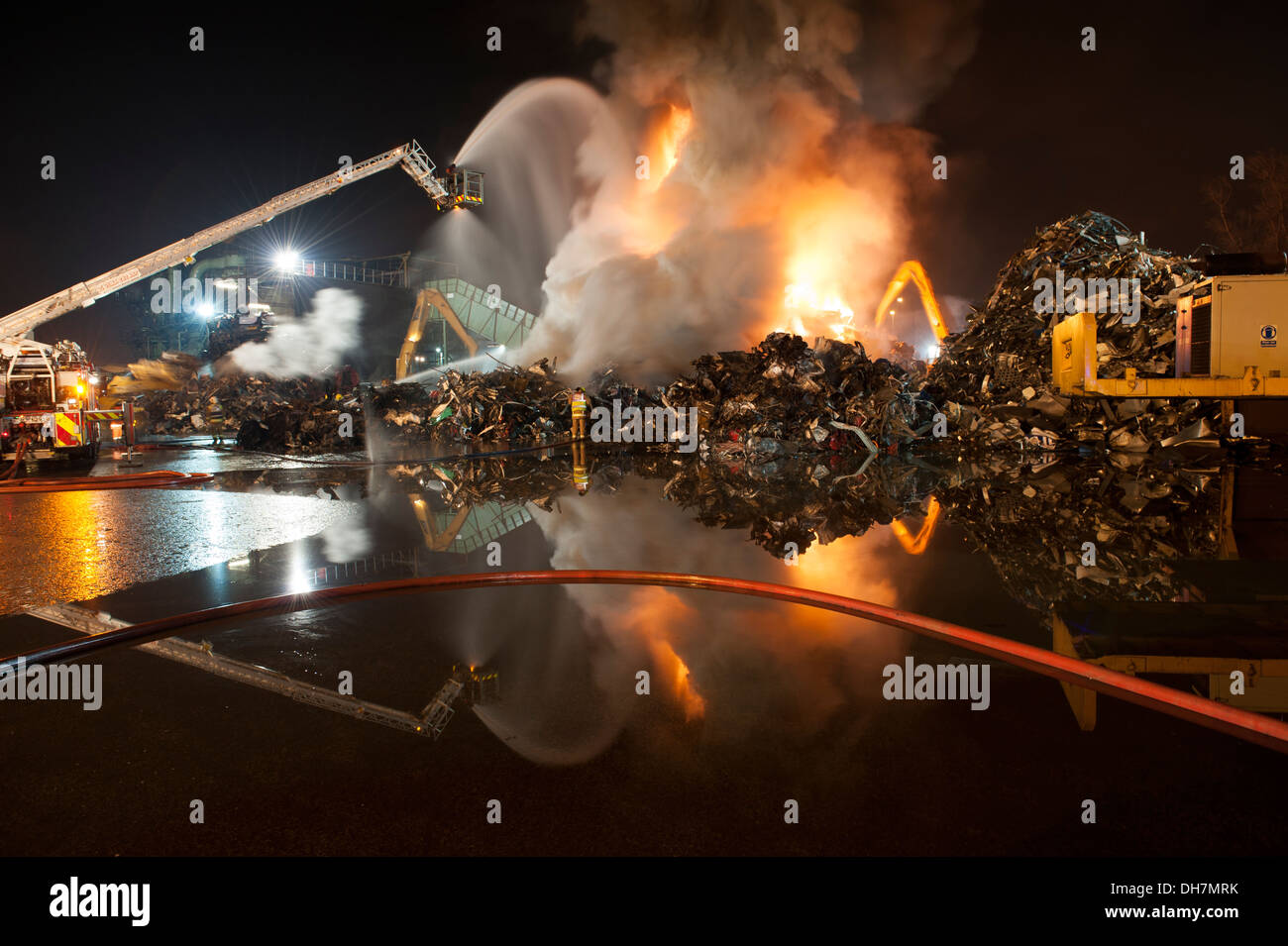Large scrapyard fire at night Stock Photo - Alamy