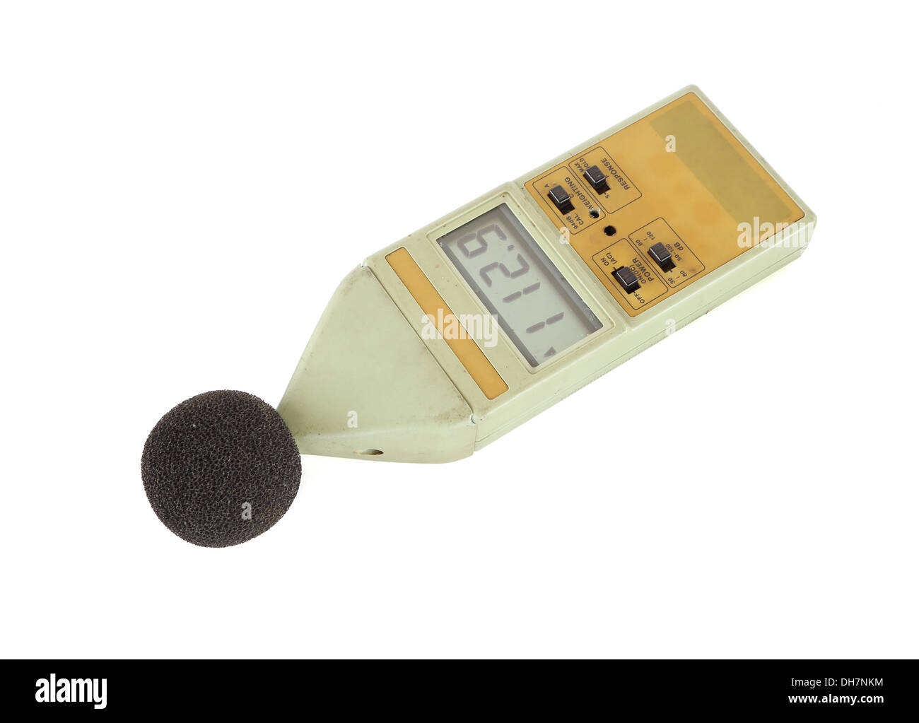old sound level meter (display show high level) on white background ...