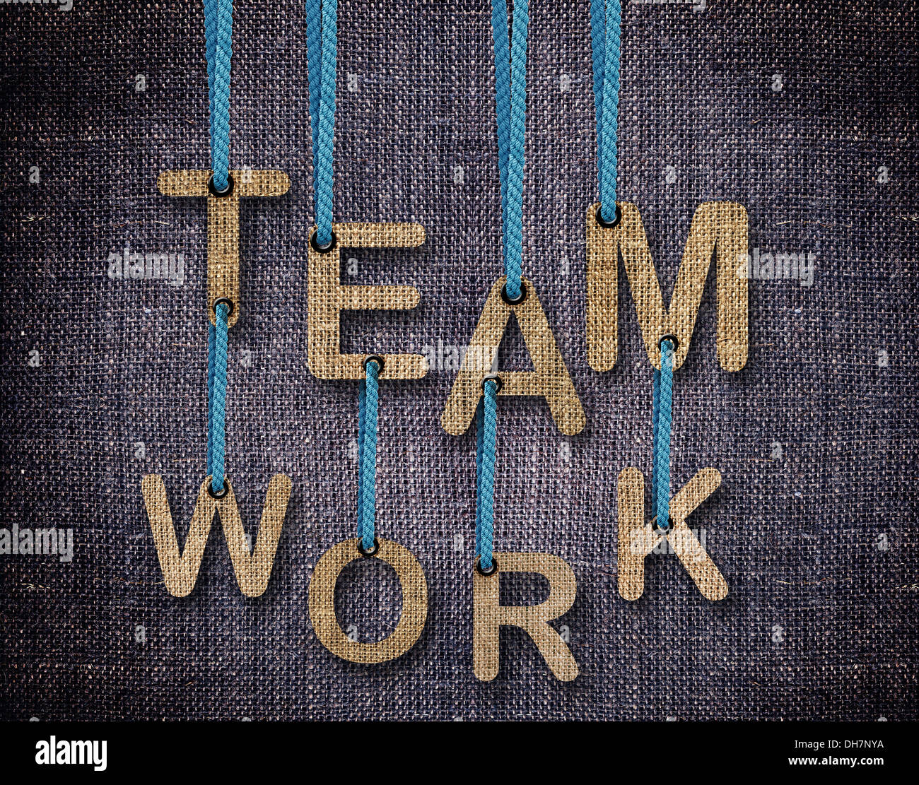Team work Letters hanging strings with blue sackcloth background Stock ...