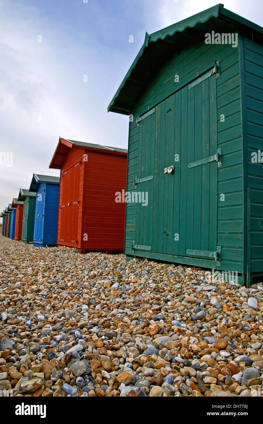 Beach huts on a shingle beach Stock Photo - Alamy
