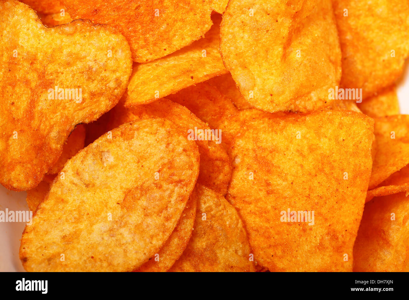 Crisps. Close up potato paprika chips as background Stock Photo - Alamy