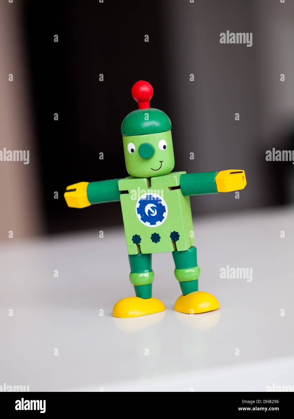 A happy, vintage, wooden toy robot Stock Photo - Alamy