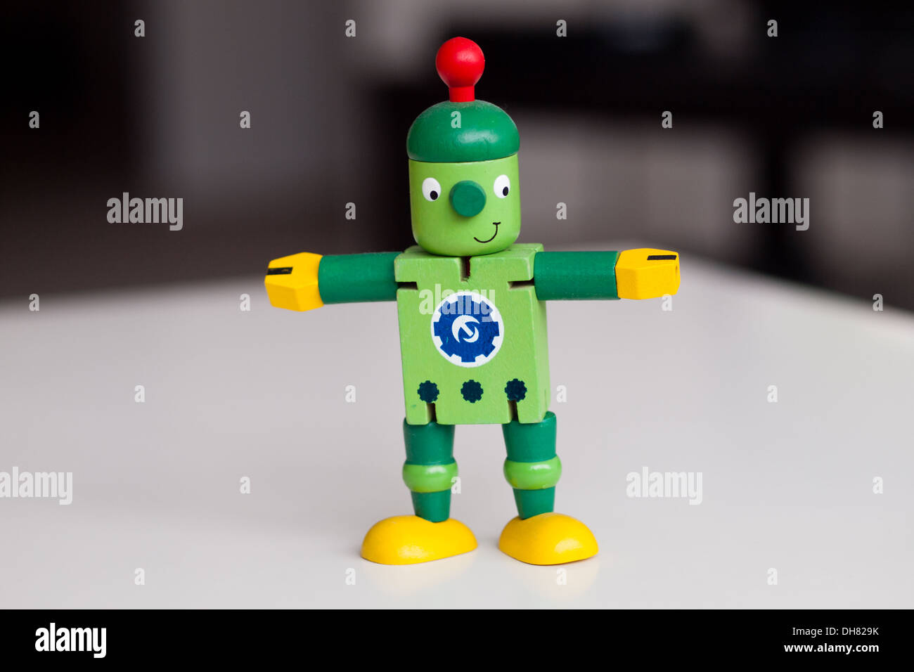 A happy, vintage, wooden toy robot Stock Photo - Alamy