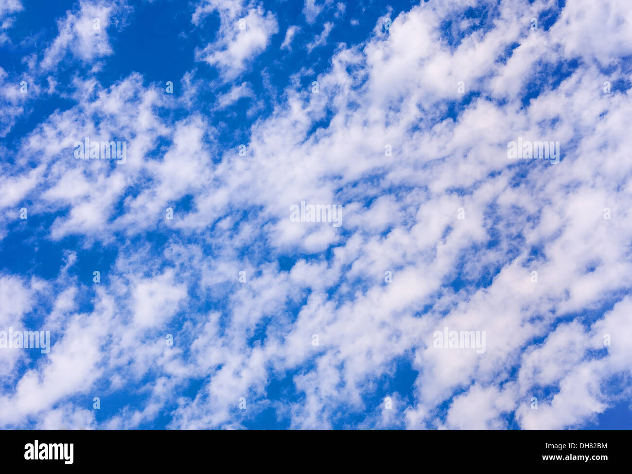 Storm clouds rolling past clear skies Stock Photo - Alamy