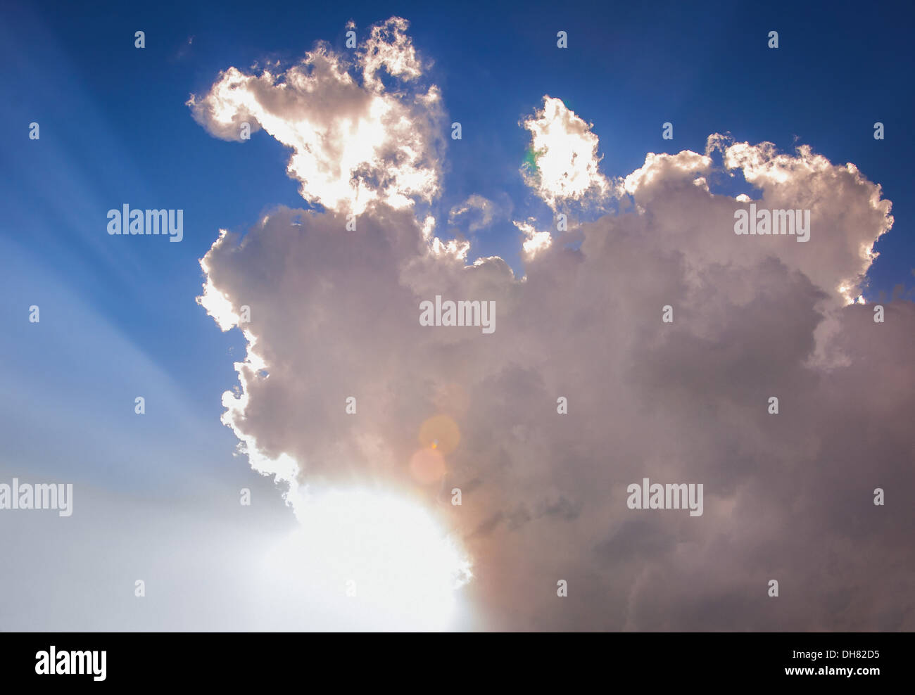 Storm clouds rolling past clear skies Stock Photo - Alamy