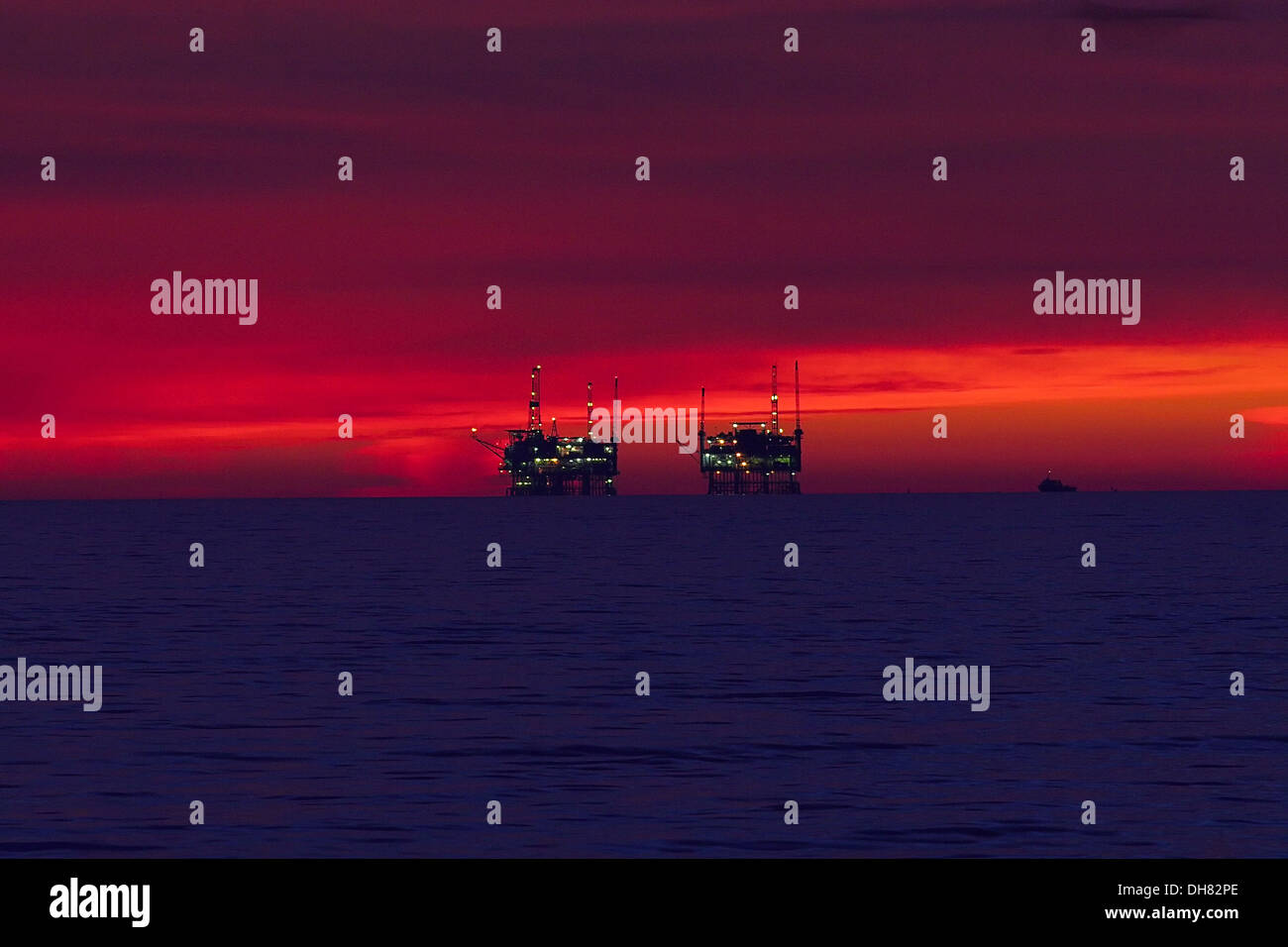 oil platforms in sunset Stock Photo - Alamy