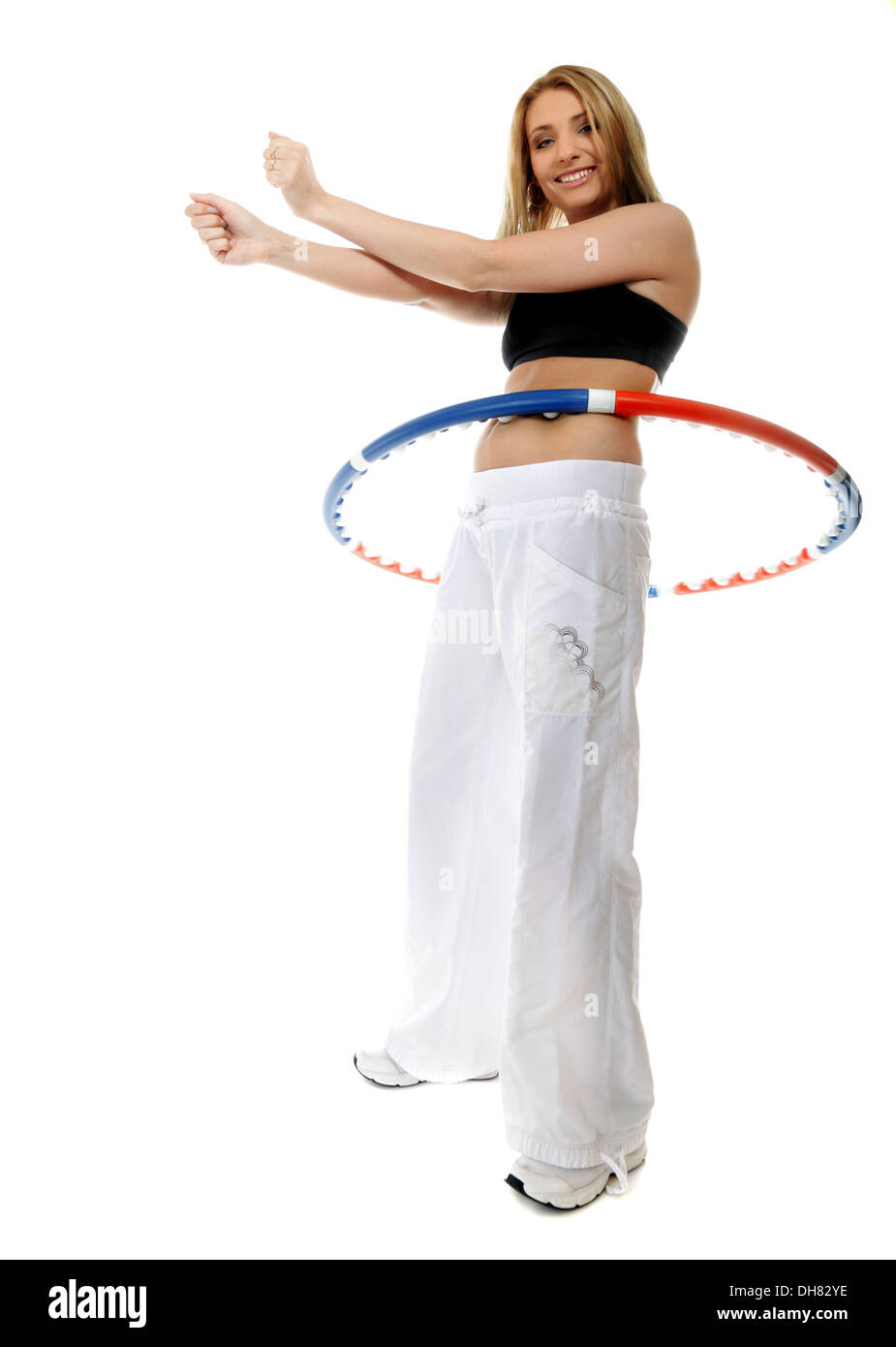 Young fitness woman with hula hoop isolated Stock Photo - Alamy