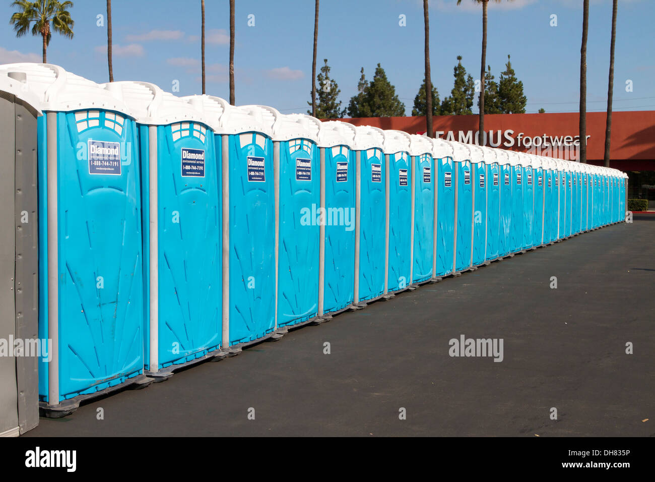 A line of plastic portable potty's at a sporting event in southern ...