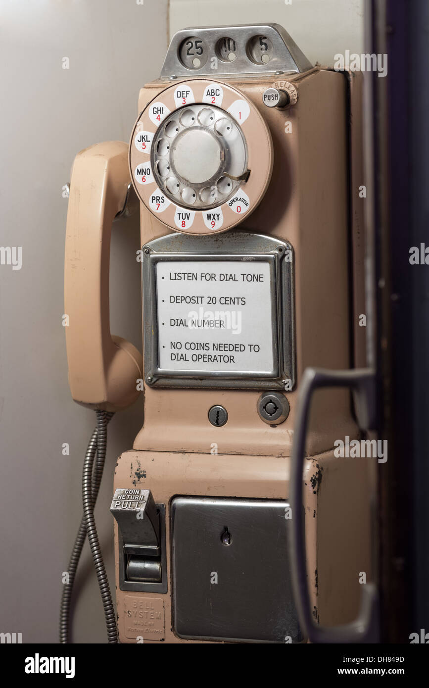 vintage rotary pay phone in booth Stock Photo - Alamy