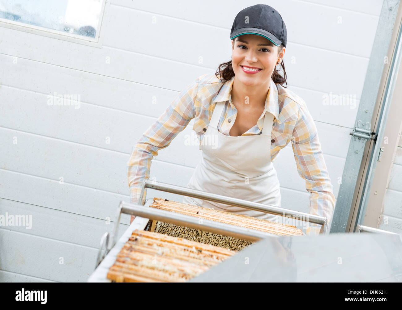 Happy Beekeeper Working In Factory Stock Photo - Alamy