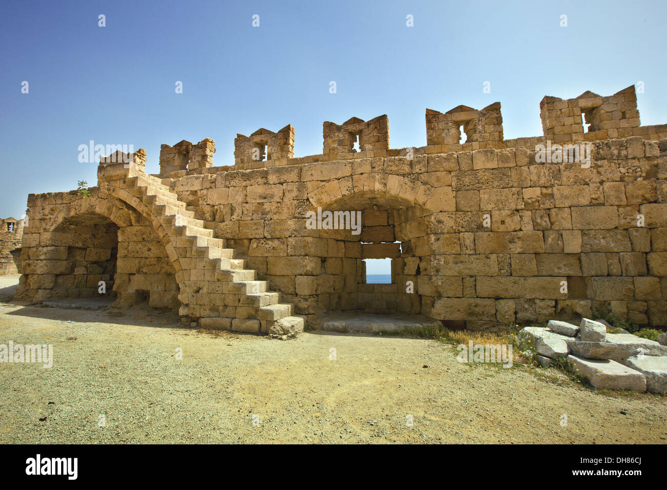 Ancient walls of the fortress by the harbor at Rhodes town, Greece ...