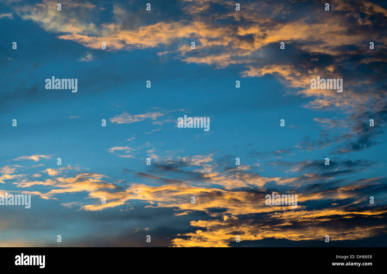 Sunset through the clouds Stock Photo - Alamy