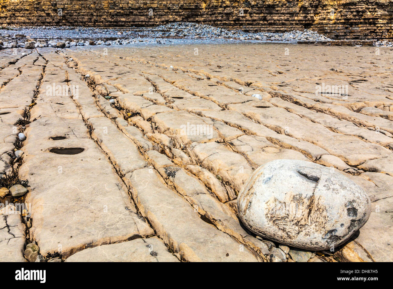 Rock strata in the cliff face and beach at Nash Point in Wales Stock ...