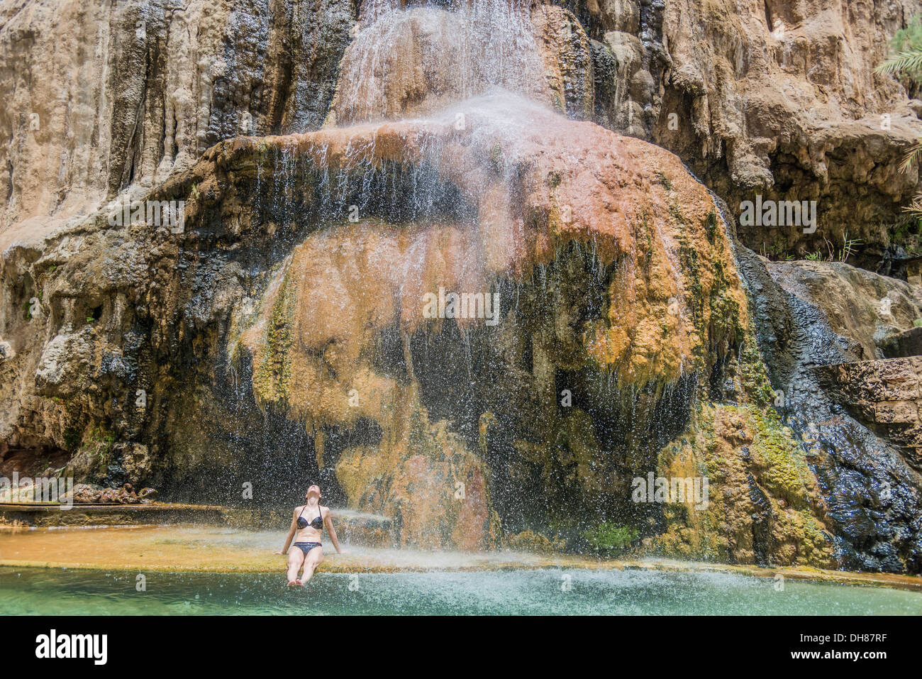 one woman bathing at ma'in hot springs waterfall in Jordan middle east ...
