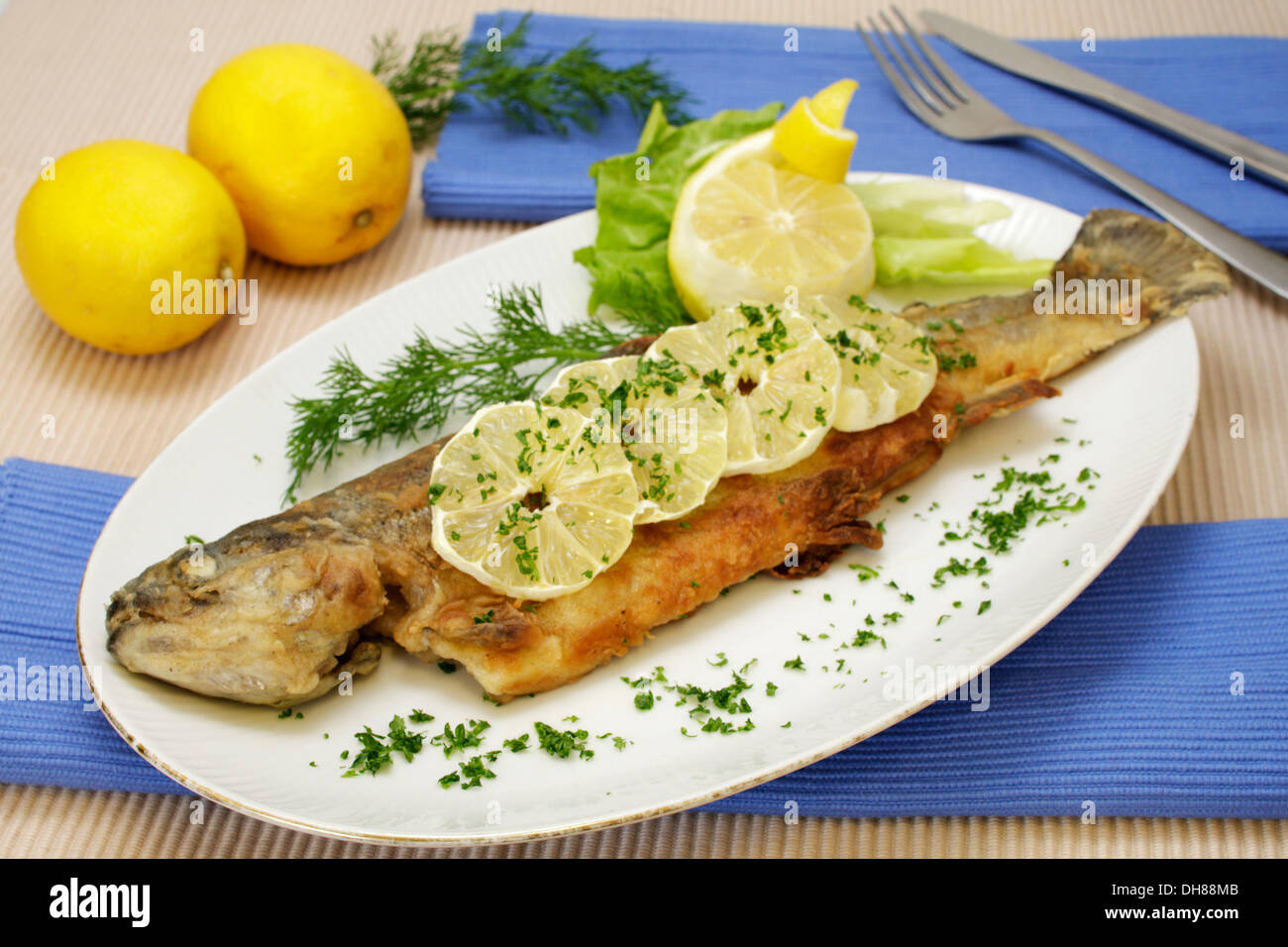 Baked Trout with lemon Stock Photo - Alamy