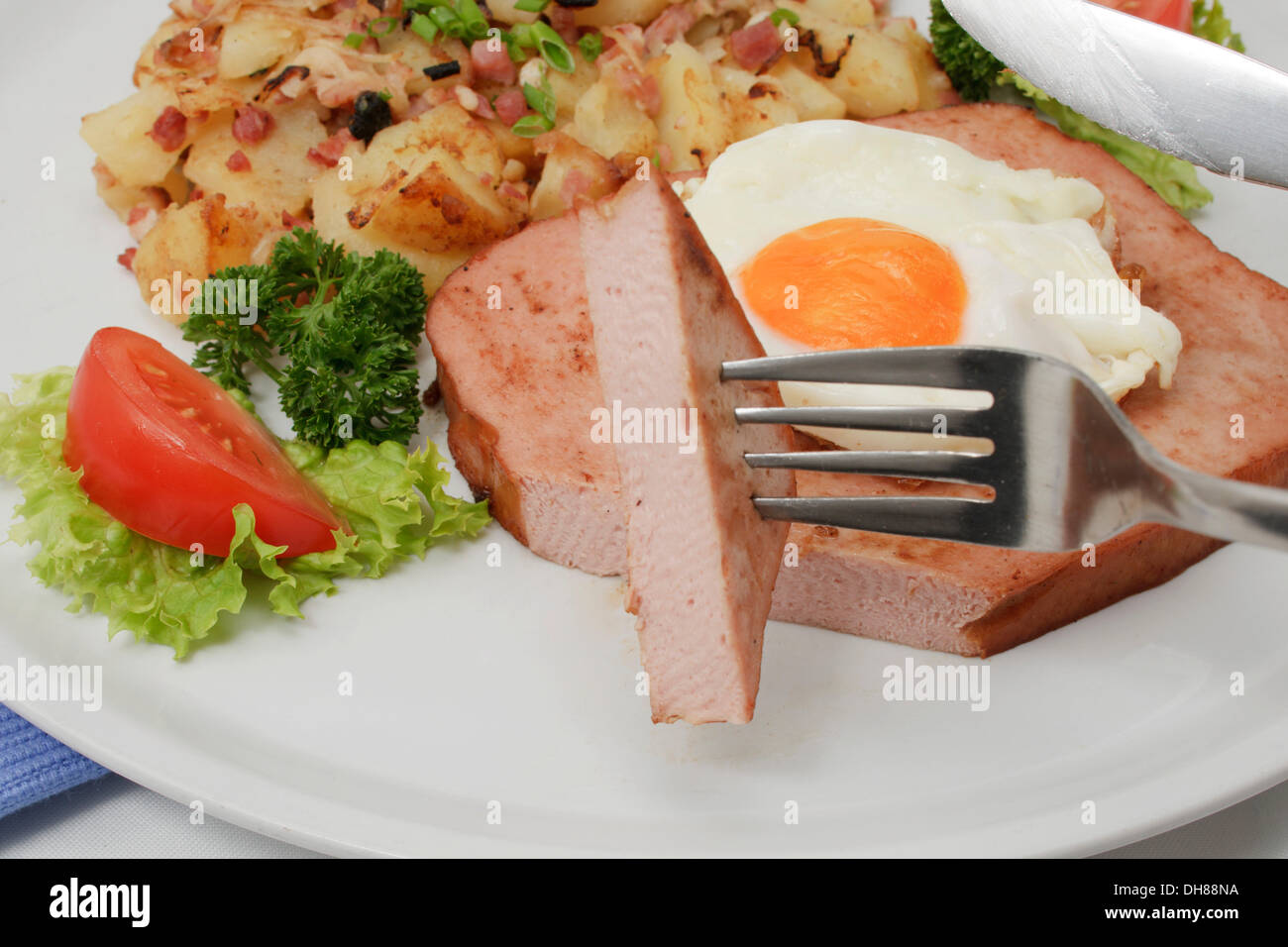 Leberkaese with fried egg and fried potatoes, Bavarian speciality Stock ...